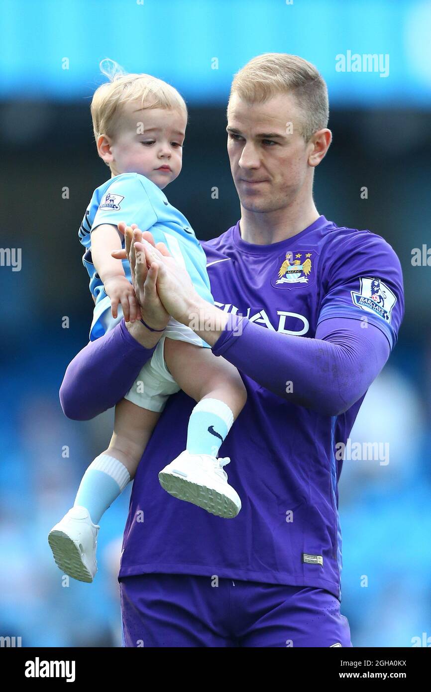 Joe Hart of Manchester City with his son during the lap of appreciation ...