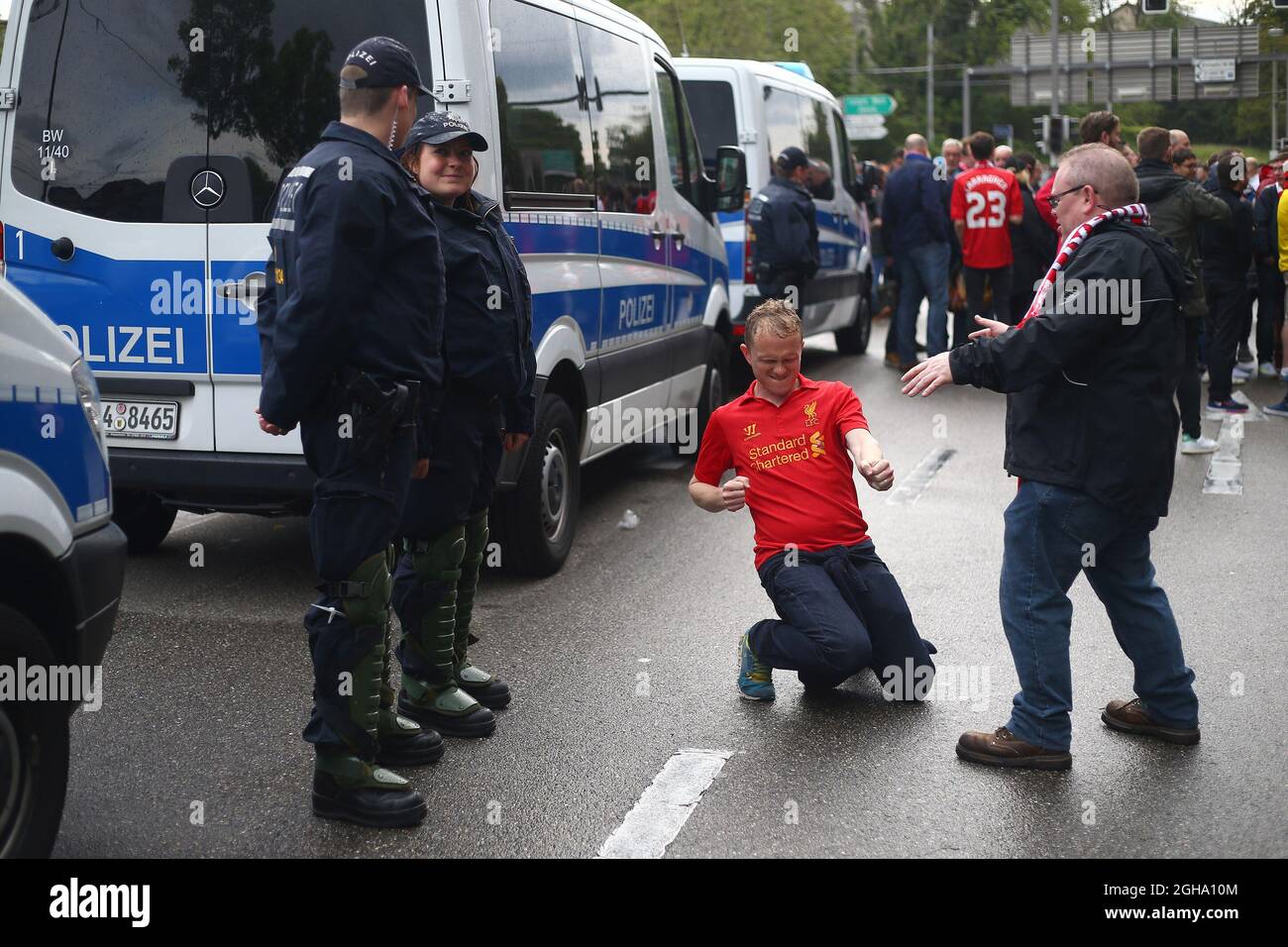 A Liverpool fan tries to impress a female police officer by dancing ...