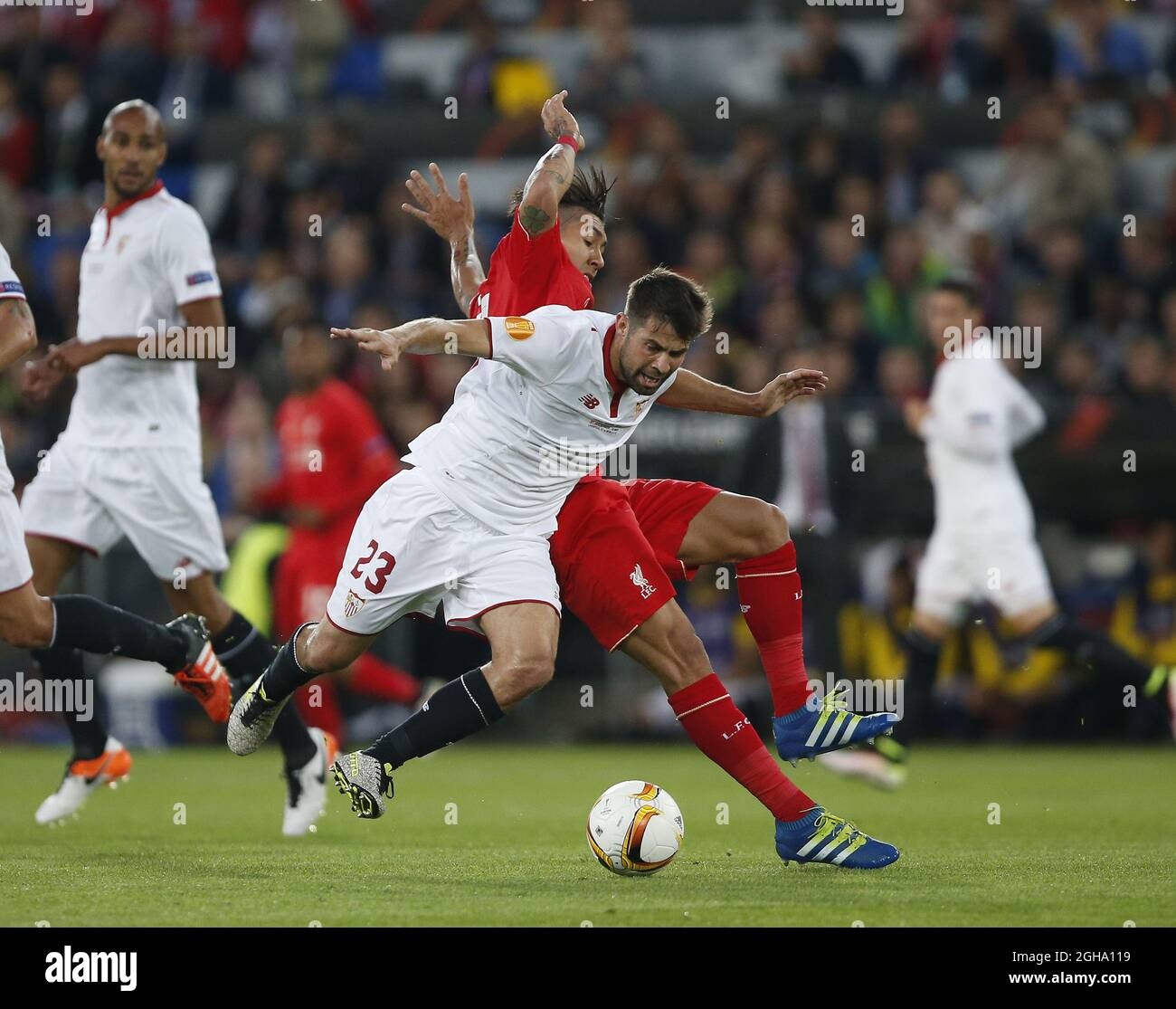 Coke of Sevilla tussles with Roberto Firmino of Liverpool during the ...