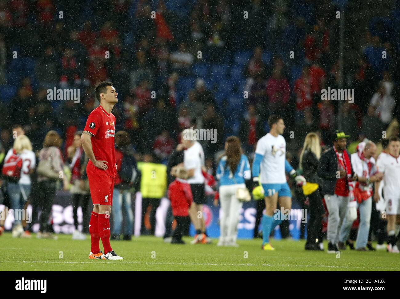 Dejan Lovren of Liverpool cries while sitting on the pitch during the ...