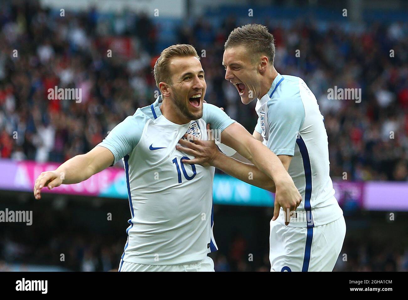 Harry Kane of England celebrates scoring the opening goal with Jamie ...