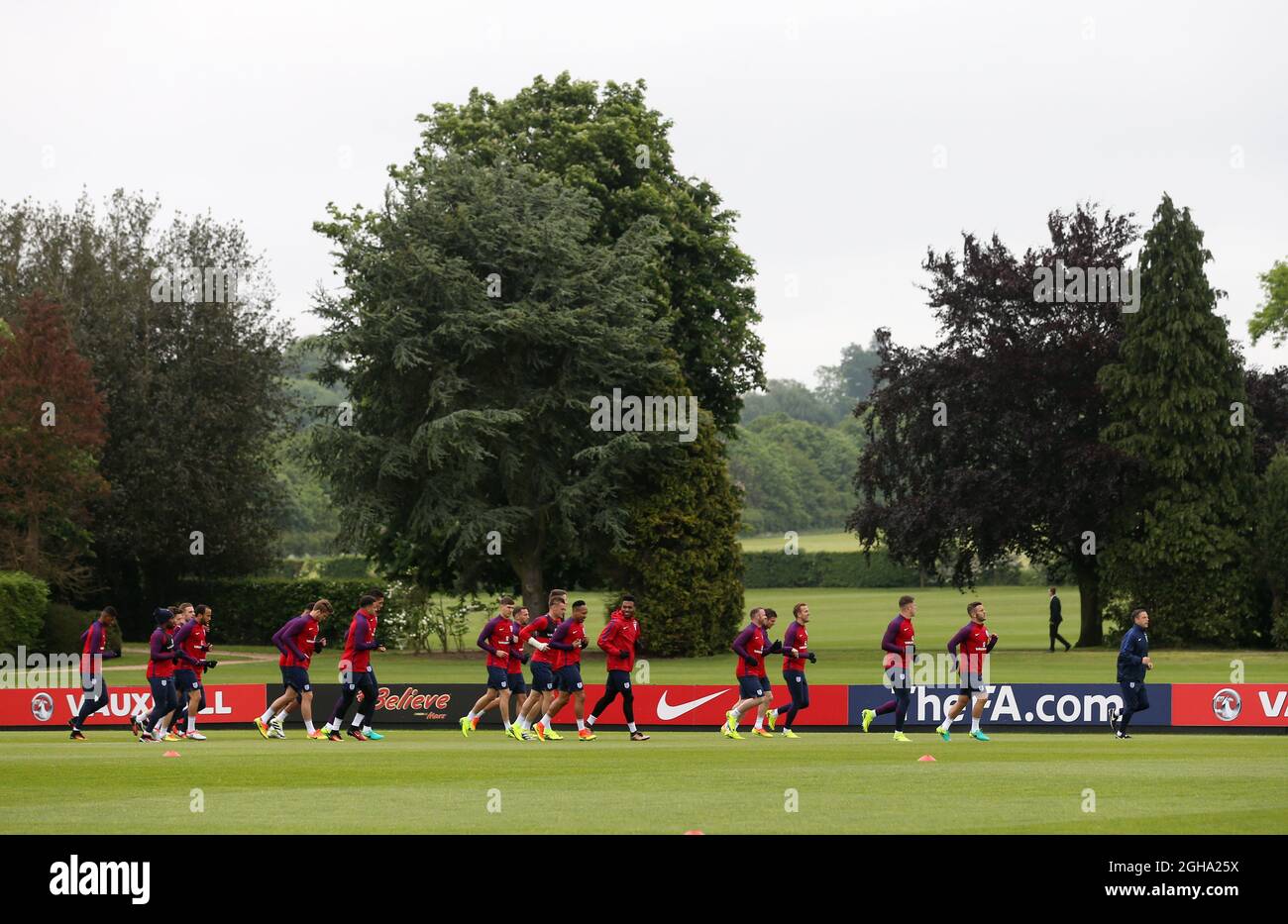 England's players warm up during training at Watford FC Training Ground ...
