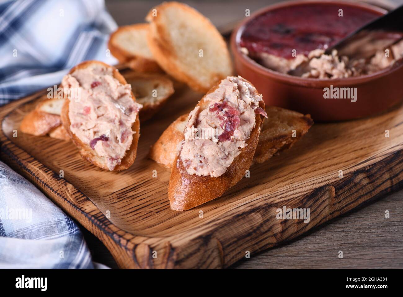 Delicate chicken pate with mashed cranberries spread on toasted ...