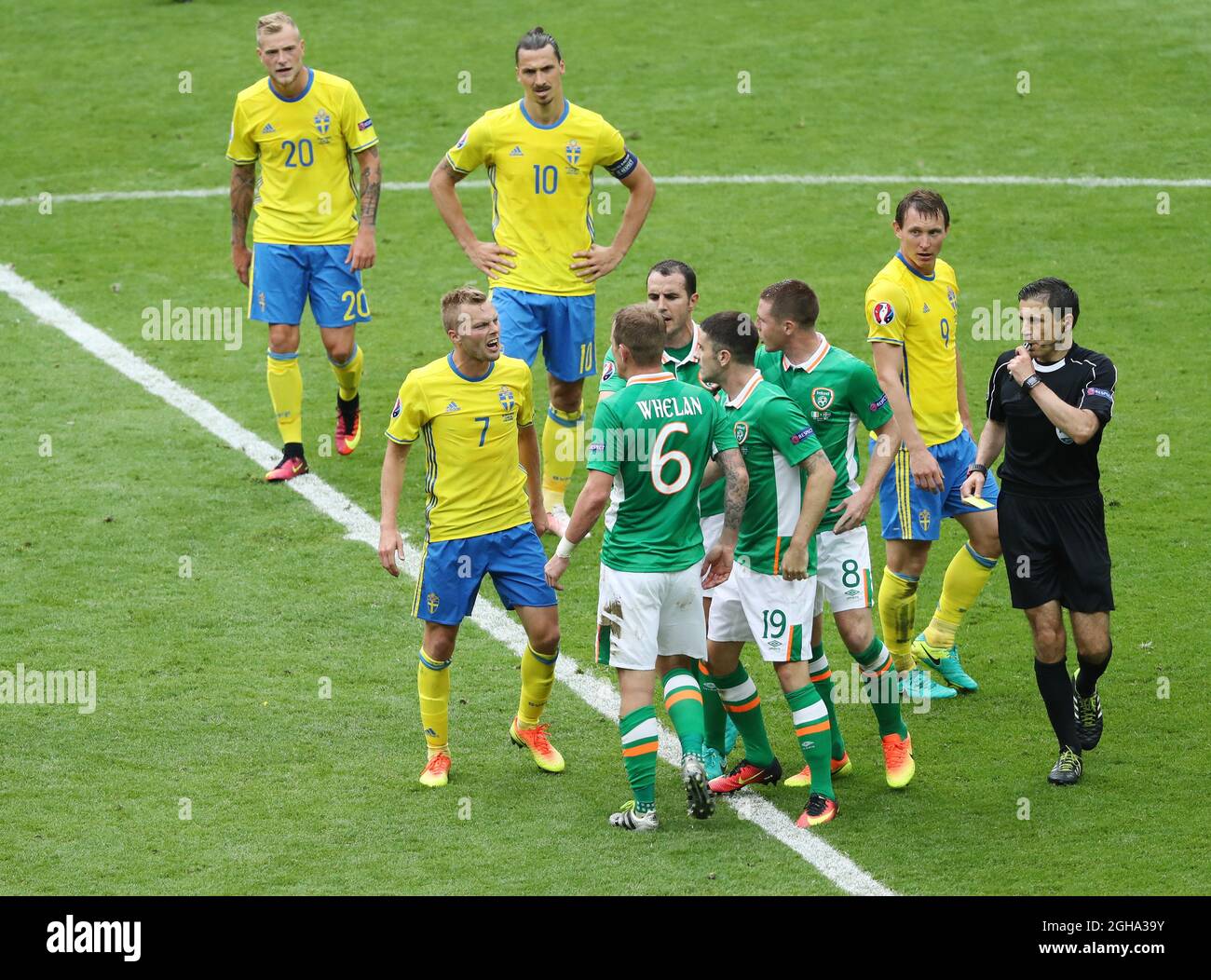 Republic of Ireland's Glenn Whelan argues with Sweden's Sebastian ...