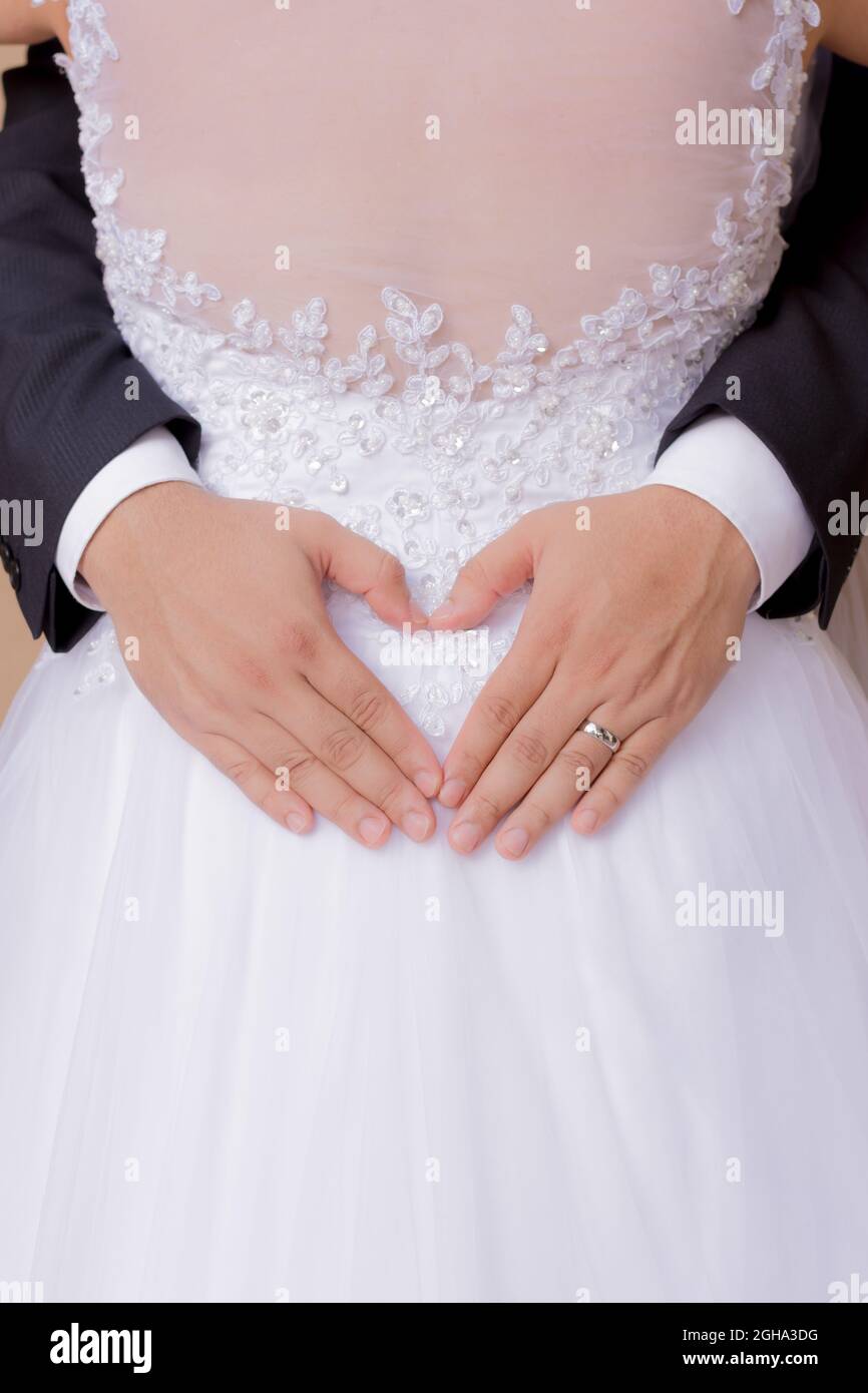 Couple white dress hands hi-res stock photography and images - Alamy