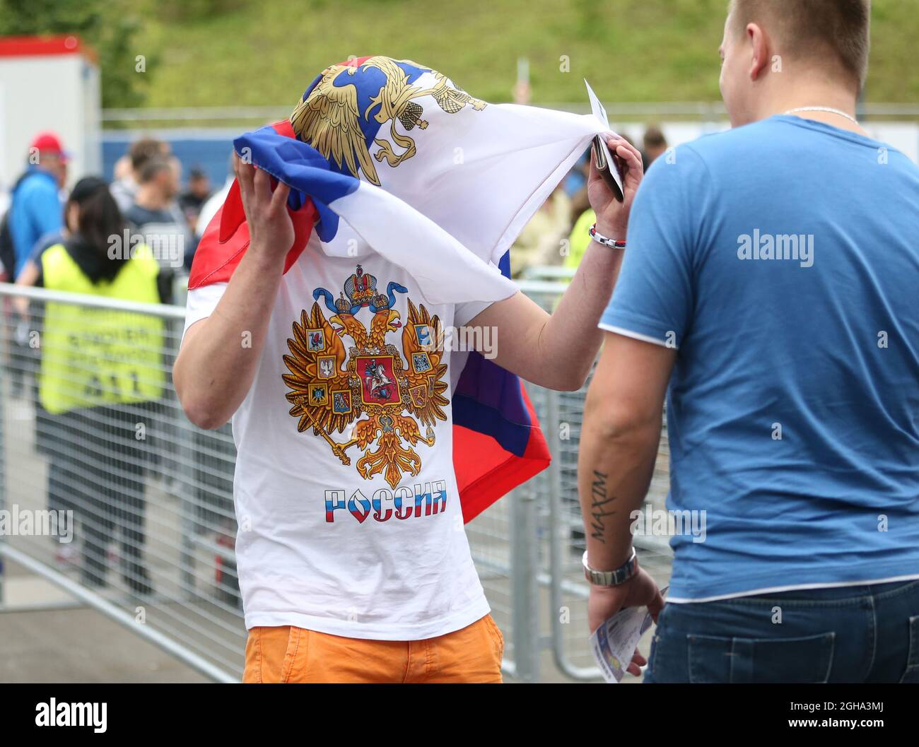 A Russian fan hides his face as enters into the stadium during the UEFA ...