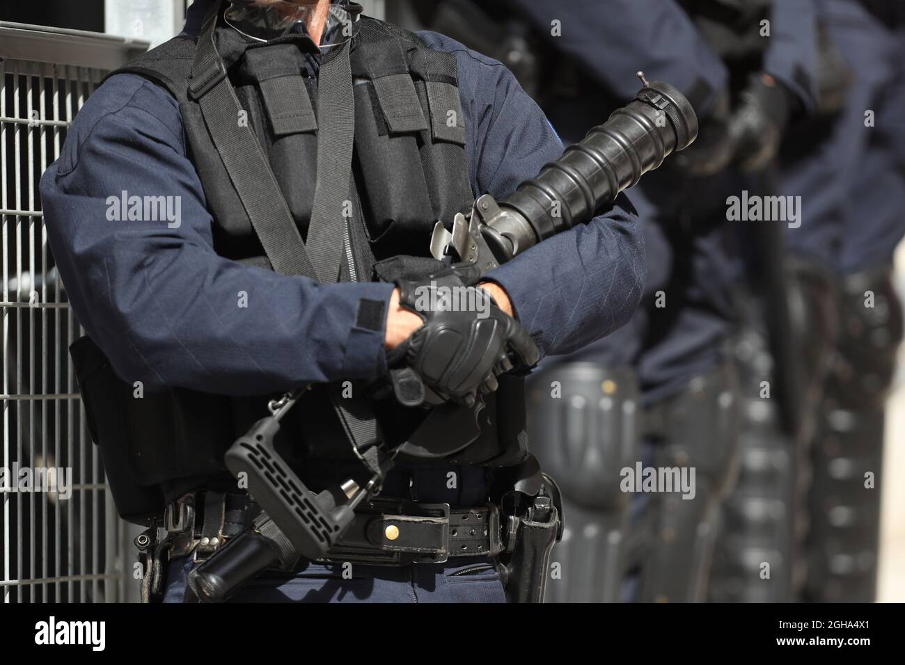 Police officer tear gas launcher hi-res stock photography and images ...