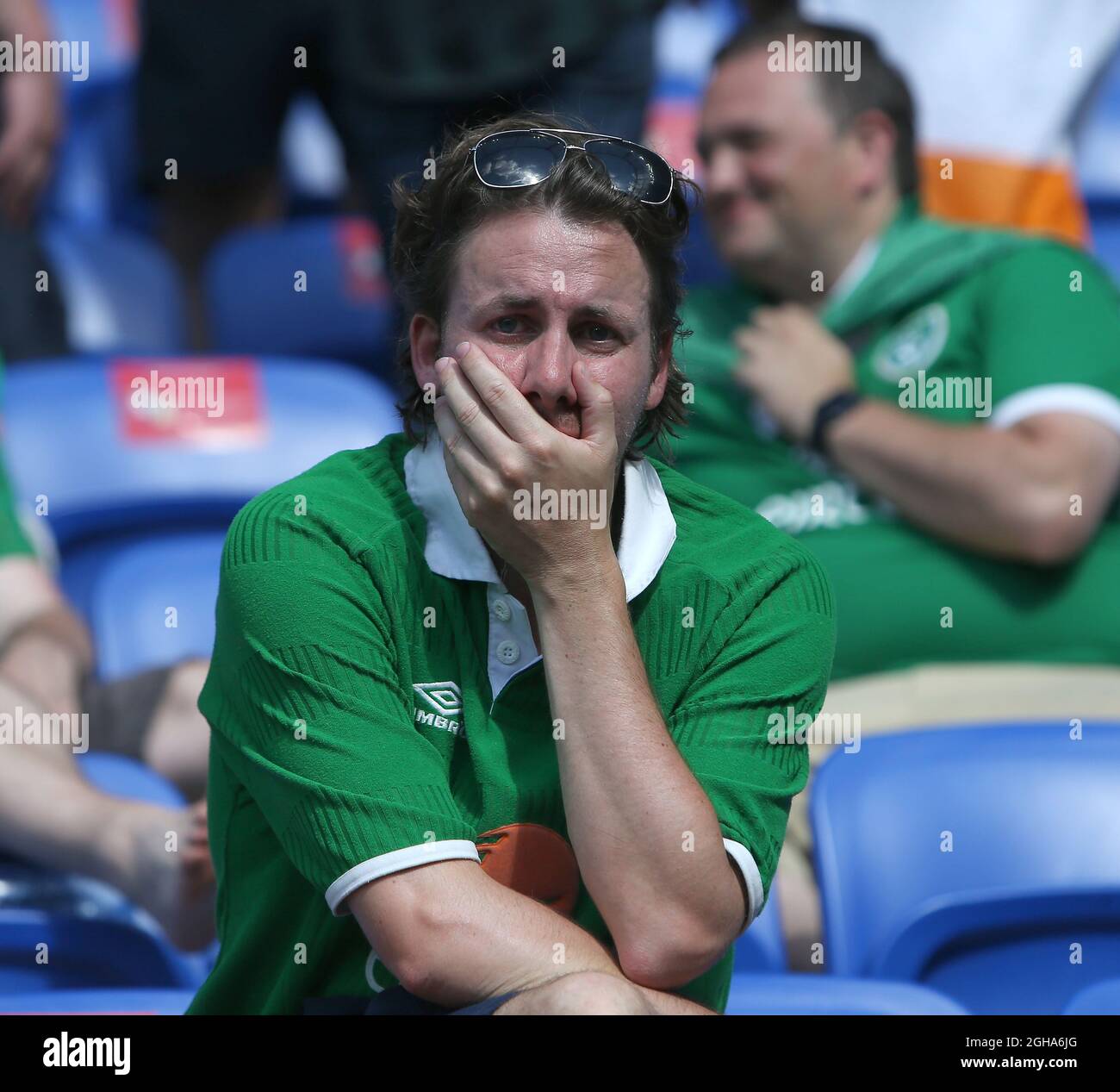 Dejected Irish fans following their exit from the tournament during the ...