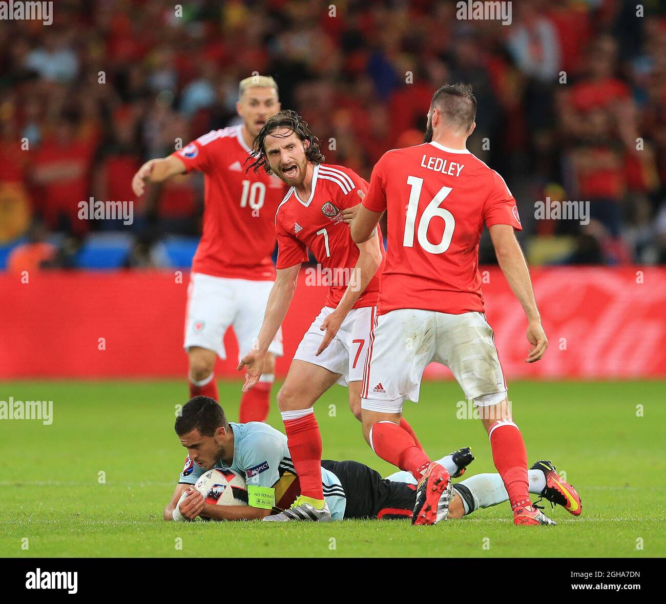Eden Hazard of Belgium handles the ball after falling down during the ...