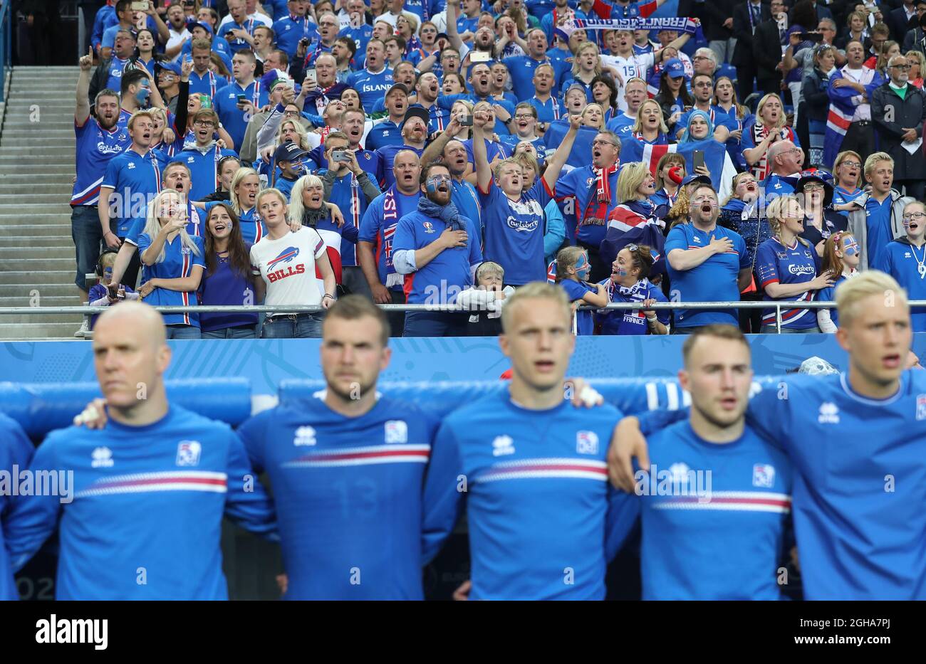 Iceland fans sing behind their players during the UEFA European ...