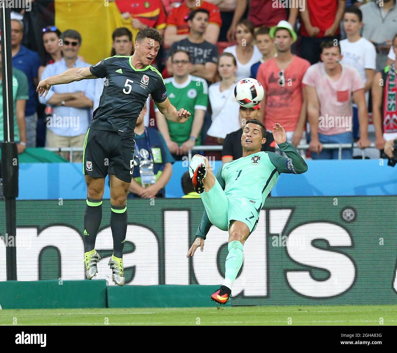 James Chester of Wales puts off Cristiano Ronaldo of Portugal as he ...