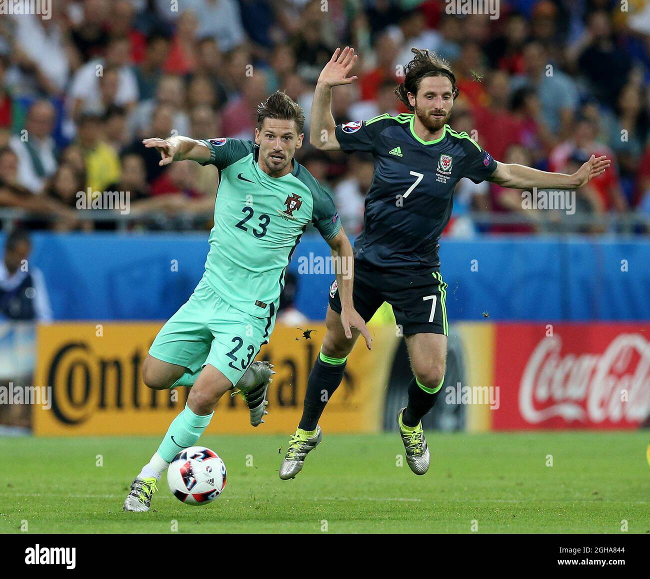Adrien Silva of Portugal skips past Joe Allen of Wales during the UEFA ...