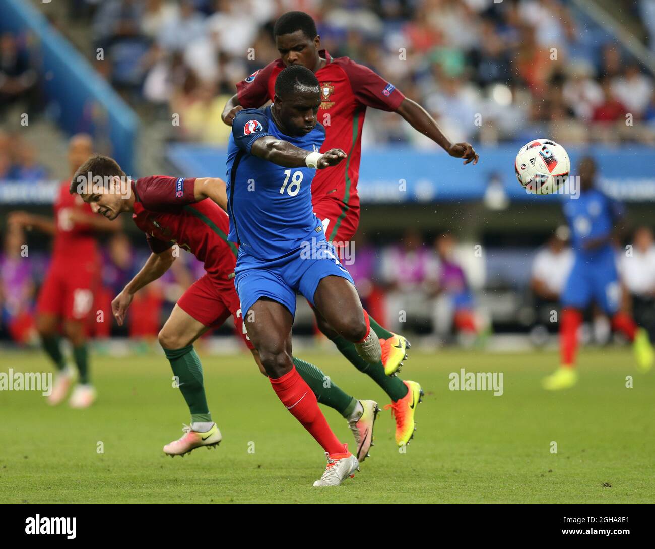 Moussa Sissoko of France tussles with Cedric of Portugal during the ...