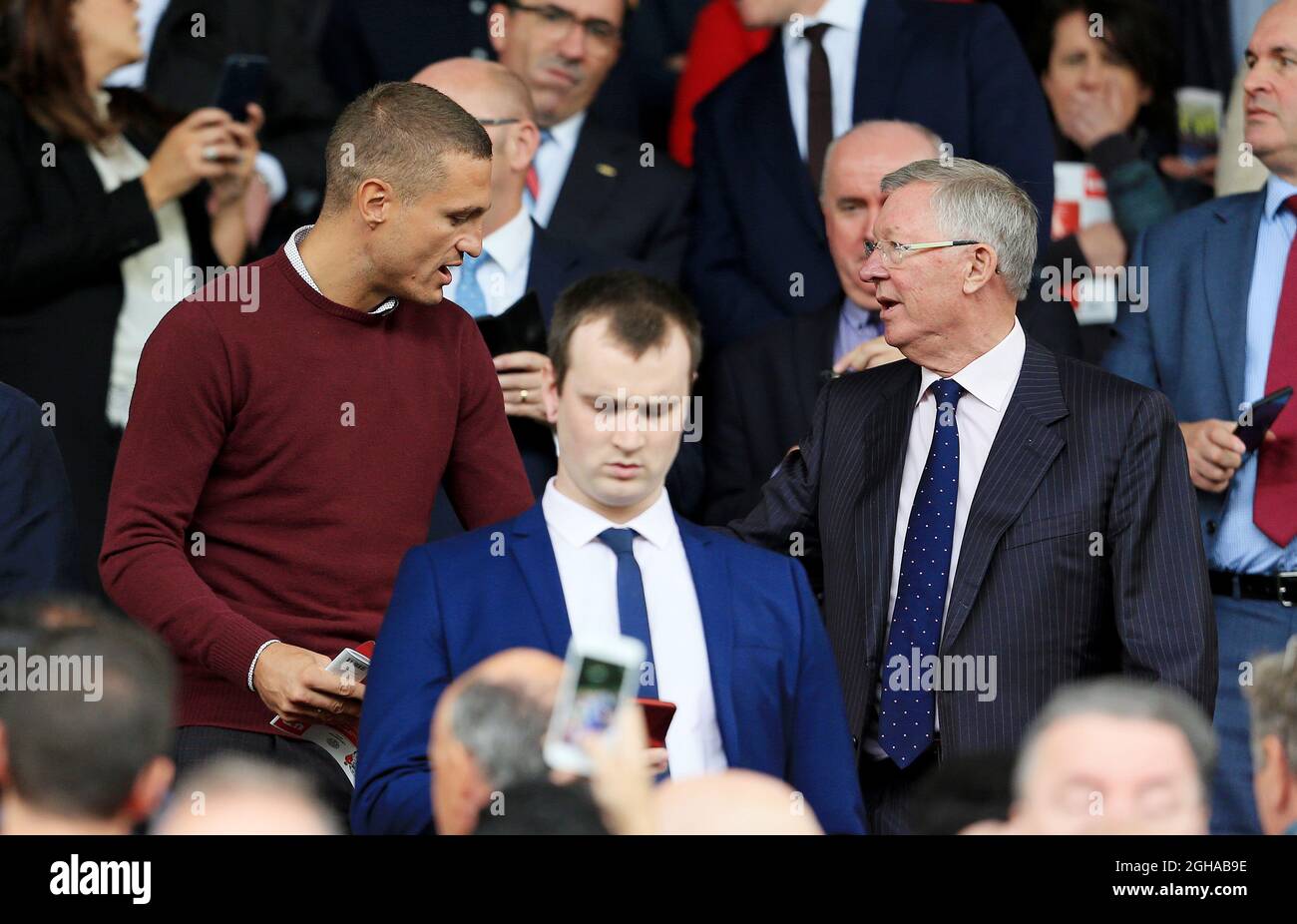 Former Manchester United Nemanja Vidic and Sir Alex Ferguson watch from ...