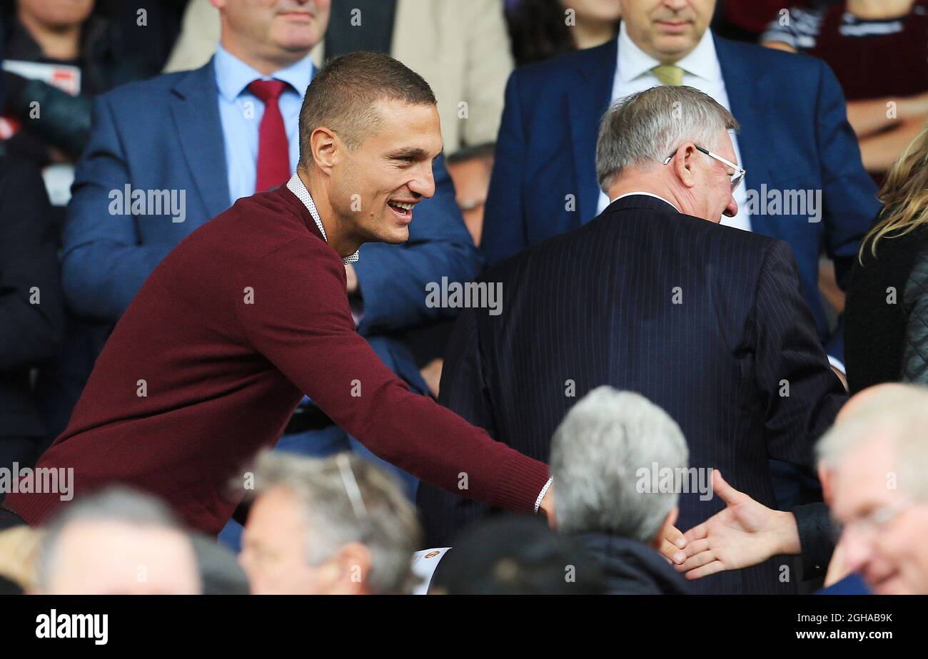 Former Manchester United Nemanja Vidic and Sir Alex Ferguson watch from ...