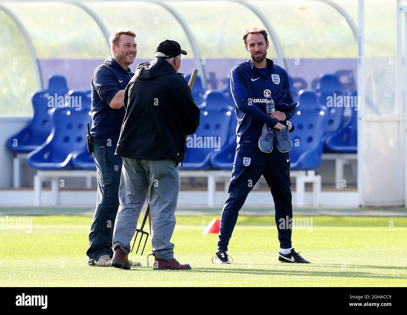England manager Gareth Southgate jokes with the ground staff during the ...