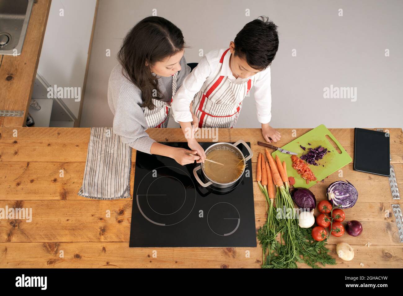 Mother son cooking in kitchen hi-res stock photography and images - Alamy