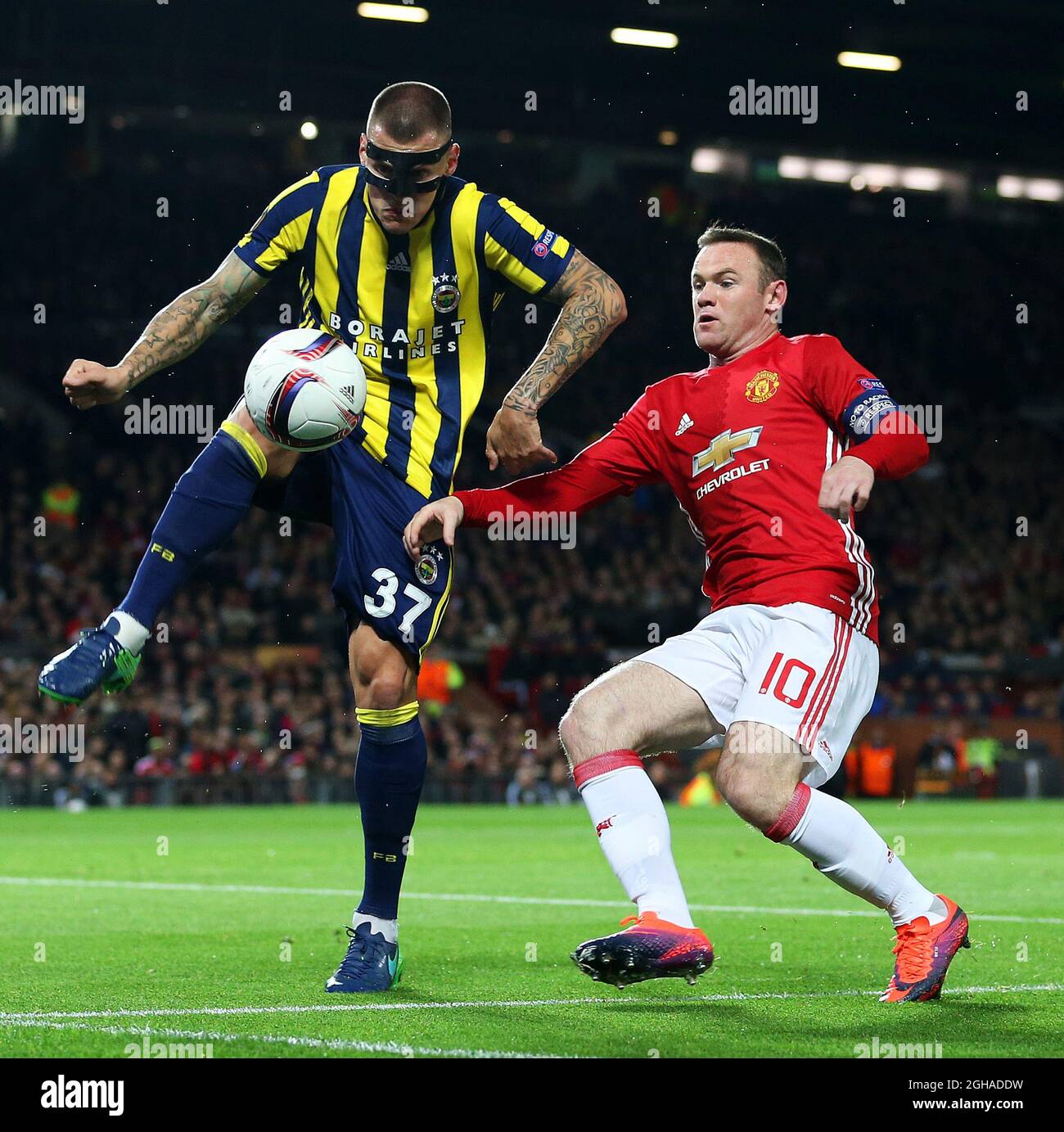 Martin Skrtel of Fenerbahce battles with Wayne Rooney of Manchester ...