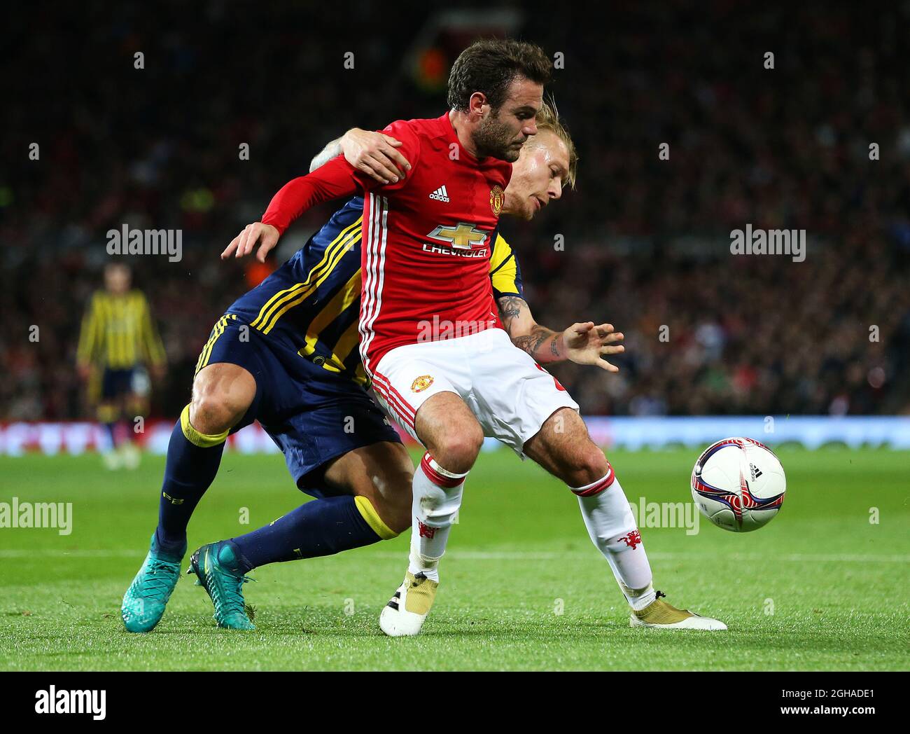 Simon Kjaer of Fenerbahce brings down Juan Mata of Manchester United ...