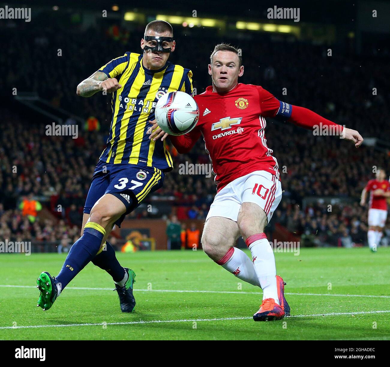 Martin Skrtel of Fenerbahce battles with Wayne Rooney of Manchester ...