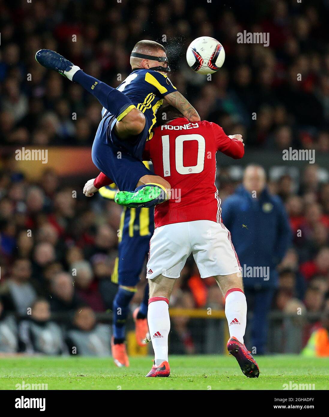 Martin Skrtel of Fenerbahce climbs above Wayne Rooney of Manchester ...