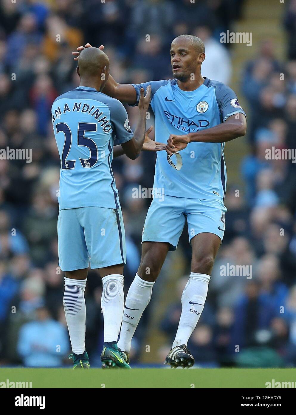 Vincent Kompany of Manchester City hands over captains armband to the ...