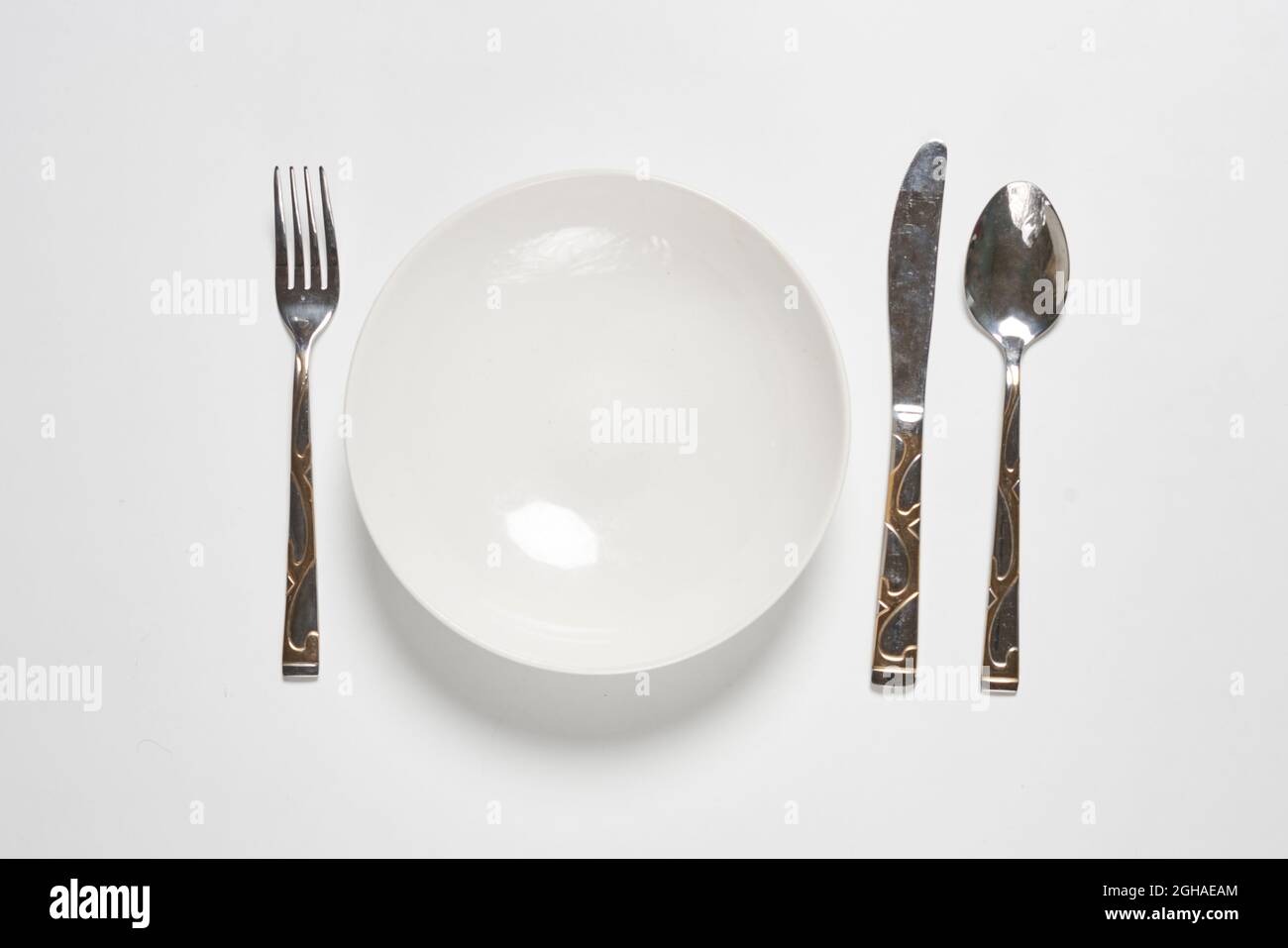 Restaurant eating items - Fork, spoon and knife on white background ...