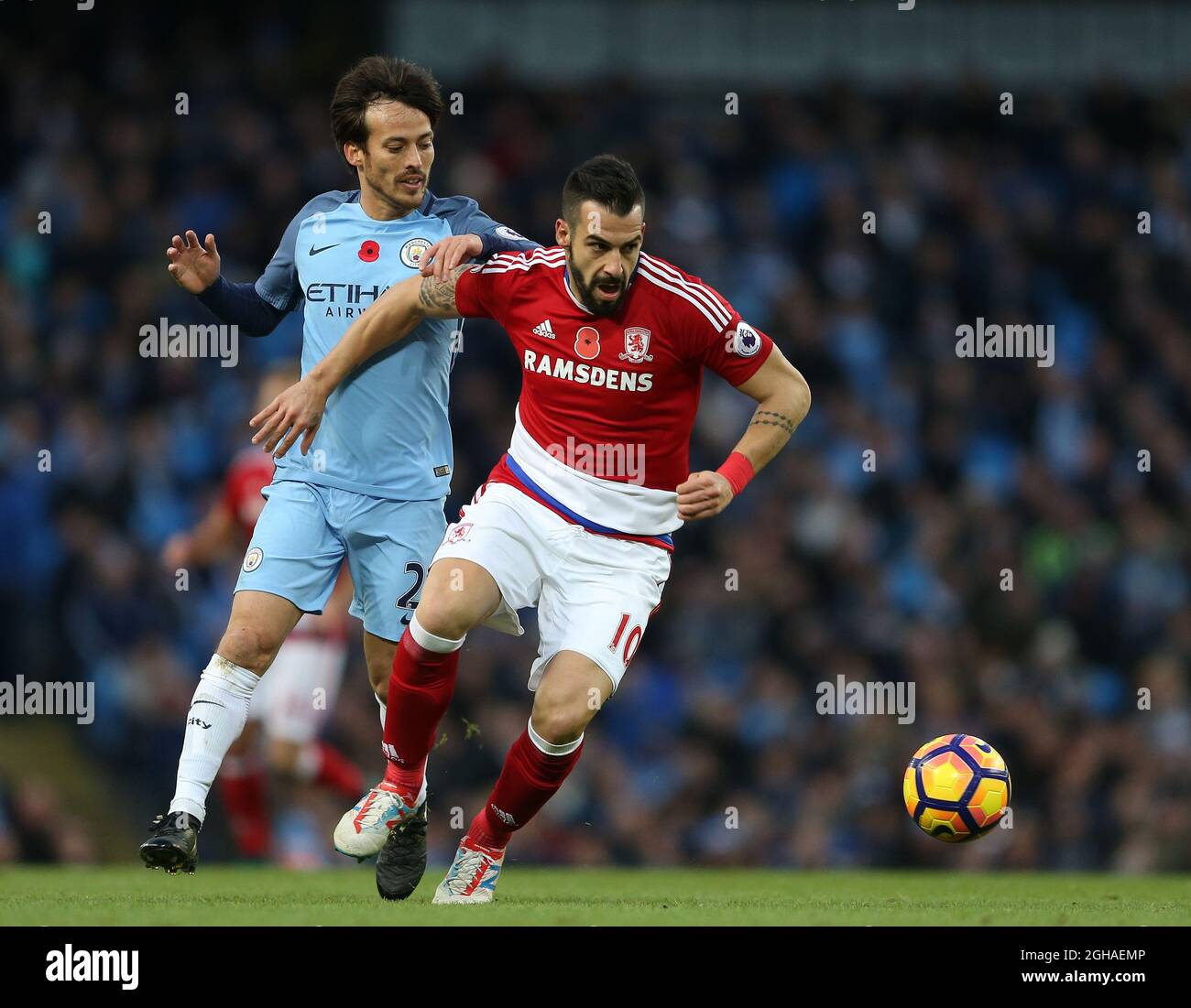 David Silva of Manchester City tussles with Alvaro Negredo of ...
