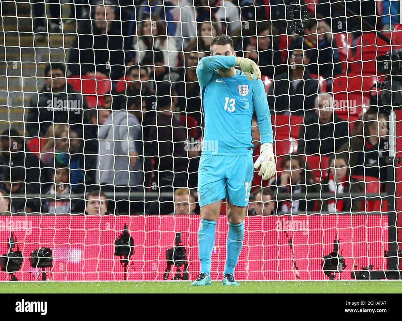 England's Tom Heaton looks on dejected after conceding his sides second ...