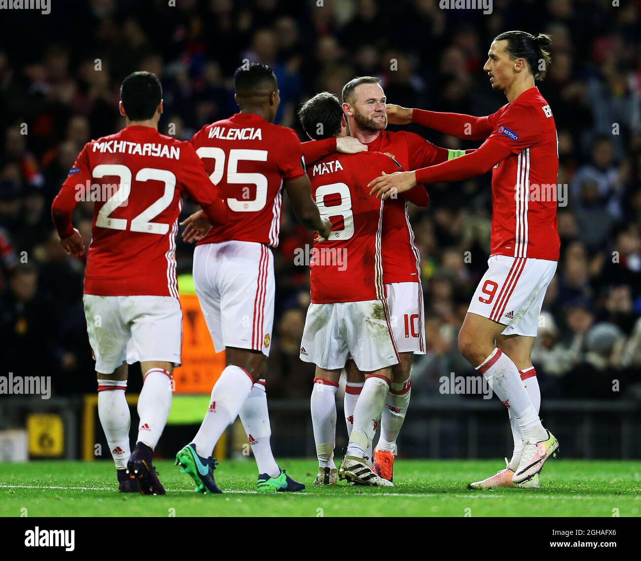 Juan Mata of Manchester United celebrates with Wayne Rooney after ...