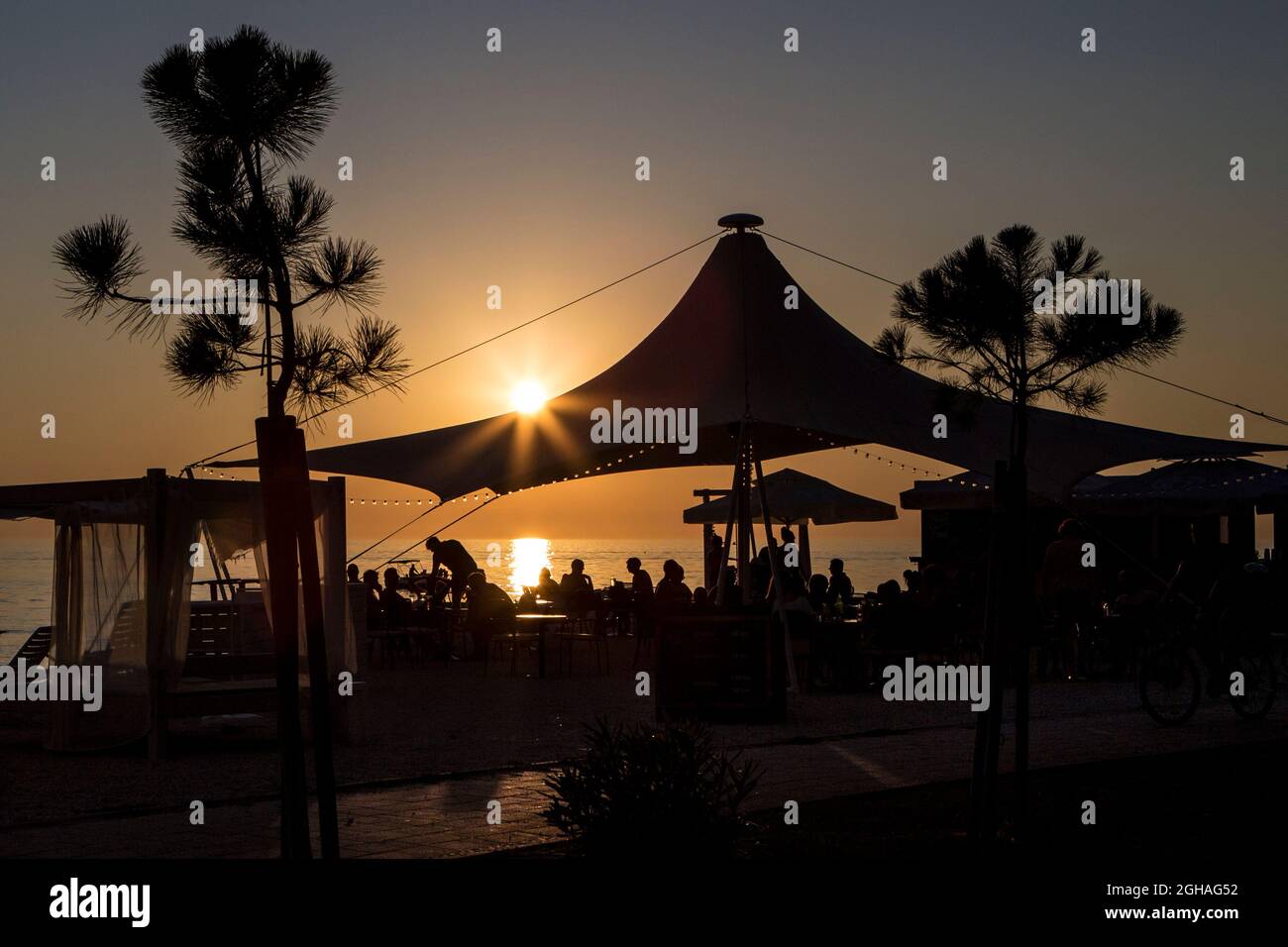 Beach bar at sunset Stock Photo - Alamy