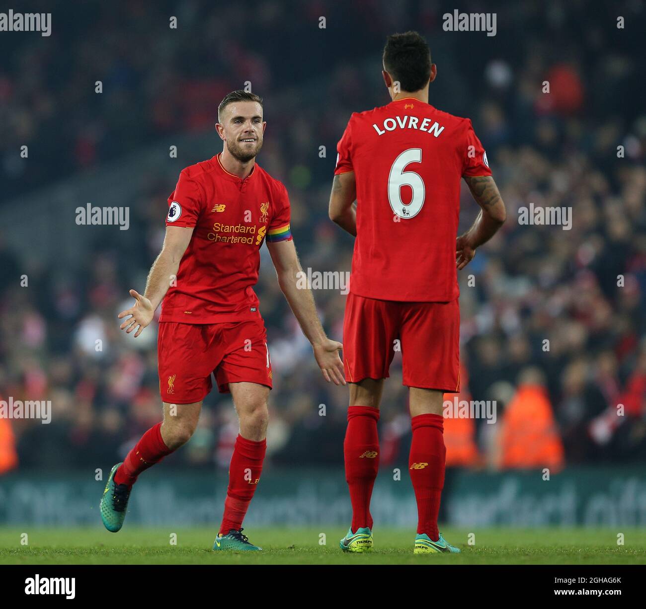 Jordan Henderson of Liverpool celebrates the win with Dejan Lovren of ...