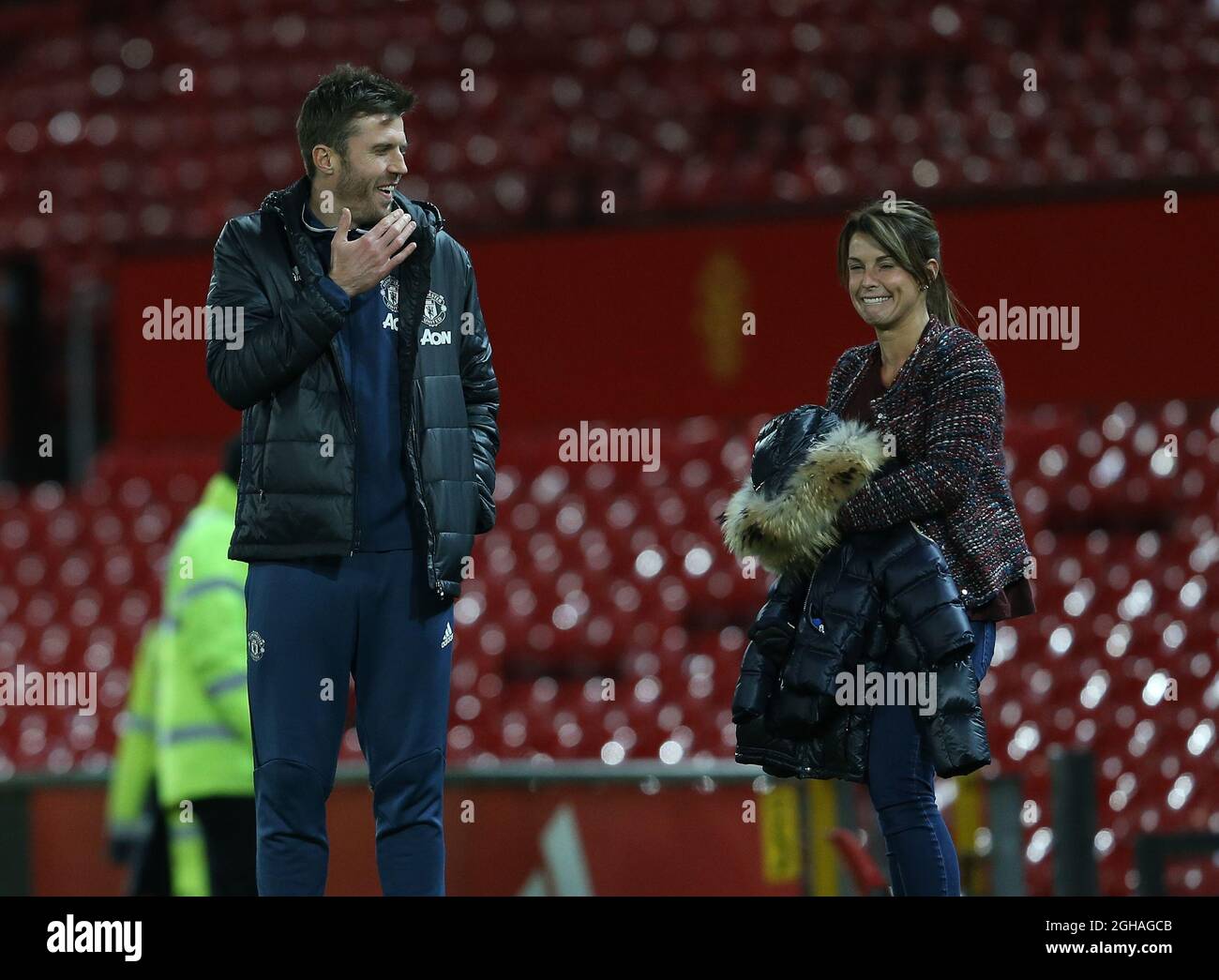 Michael Carrick of Manchester United shares a joke with Coleen Ronney ...