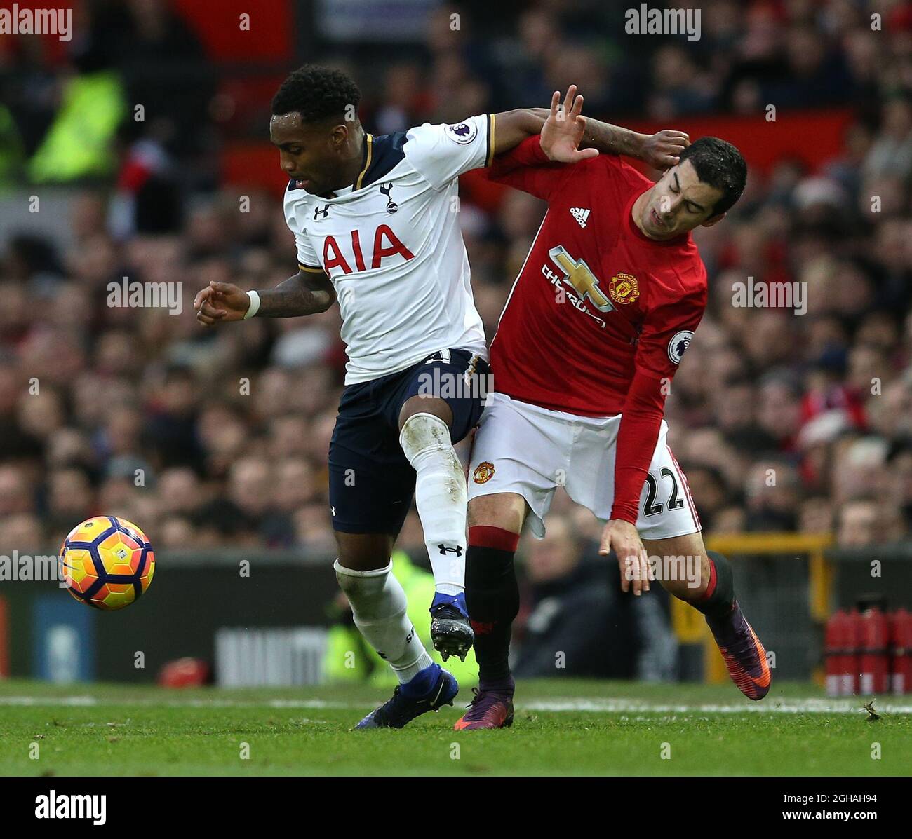 Danny Rose of Tottenham tussles with Henrikh Mkhitaryan of Manchester ...