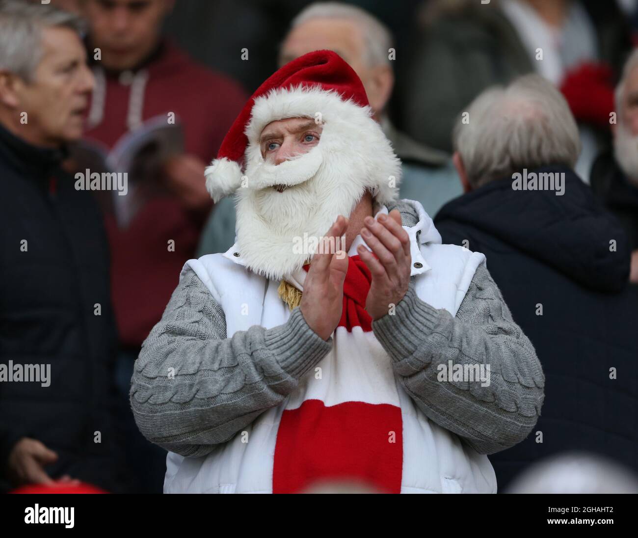 A fan dressed as Father Christmas in the stands during the English ...