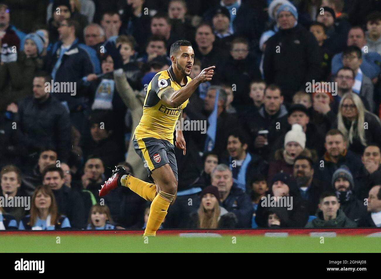 Theo Walcott of Arsenal celebrates the opening goal during the English ...