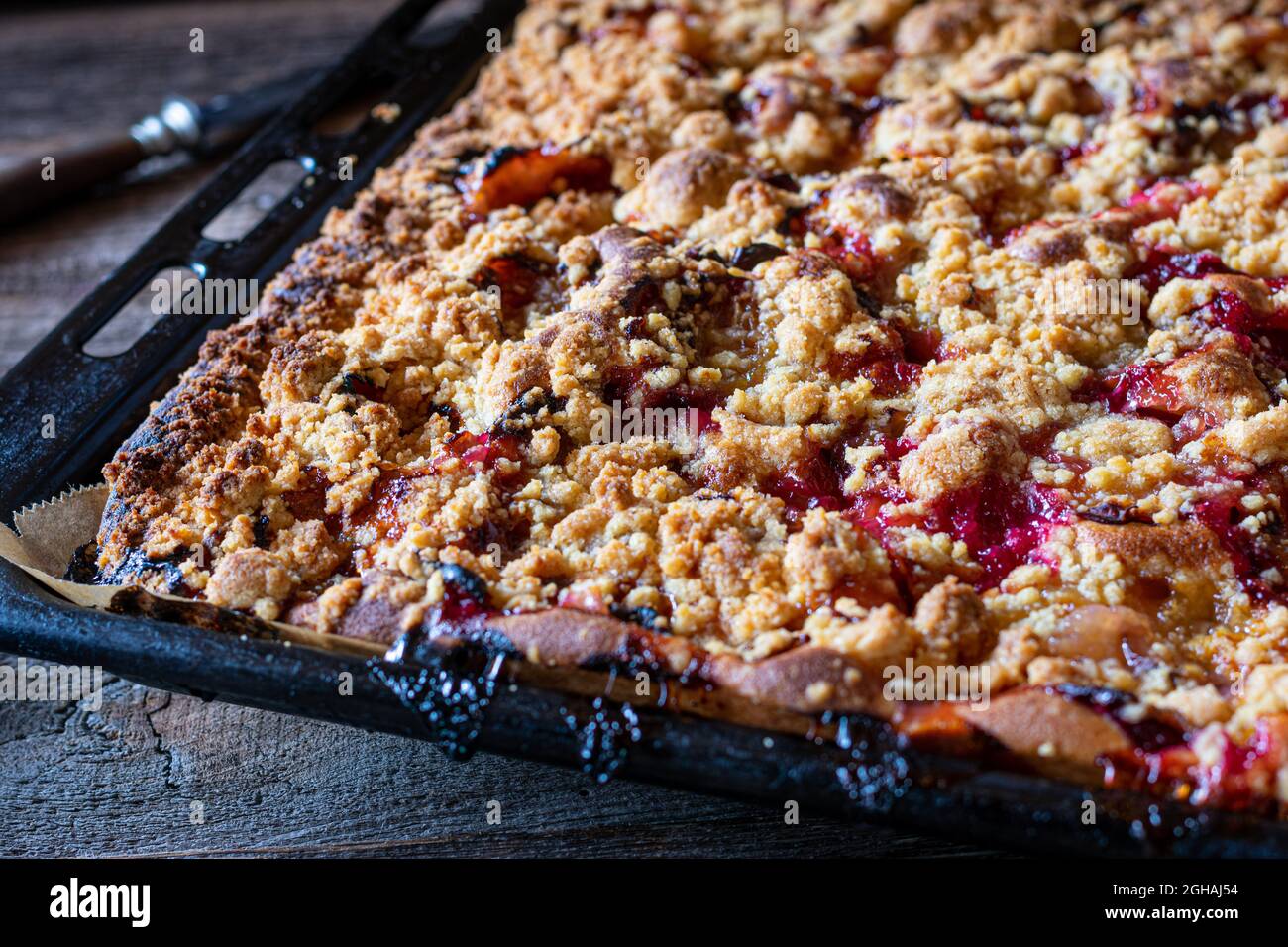 Plum crumble cake fresh and homemade baked on a baking sheet Stock ...