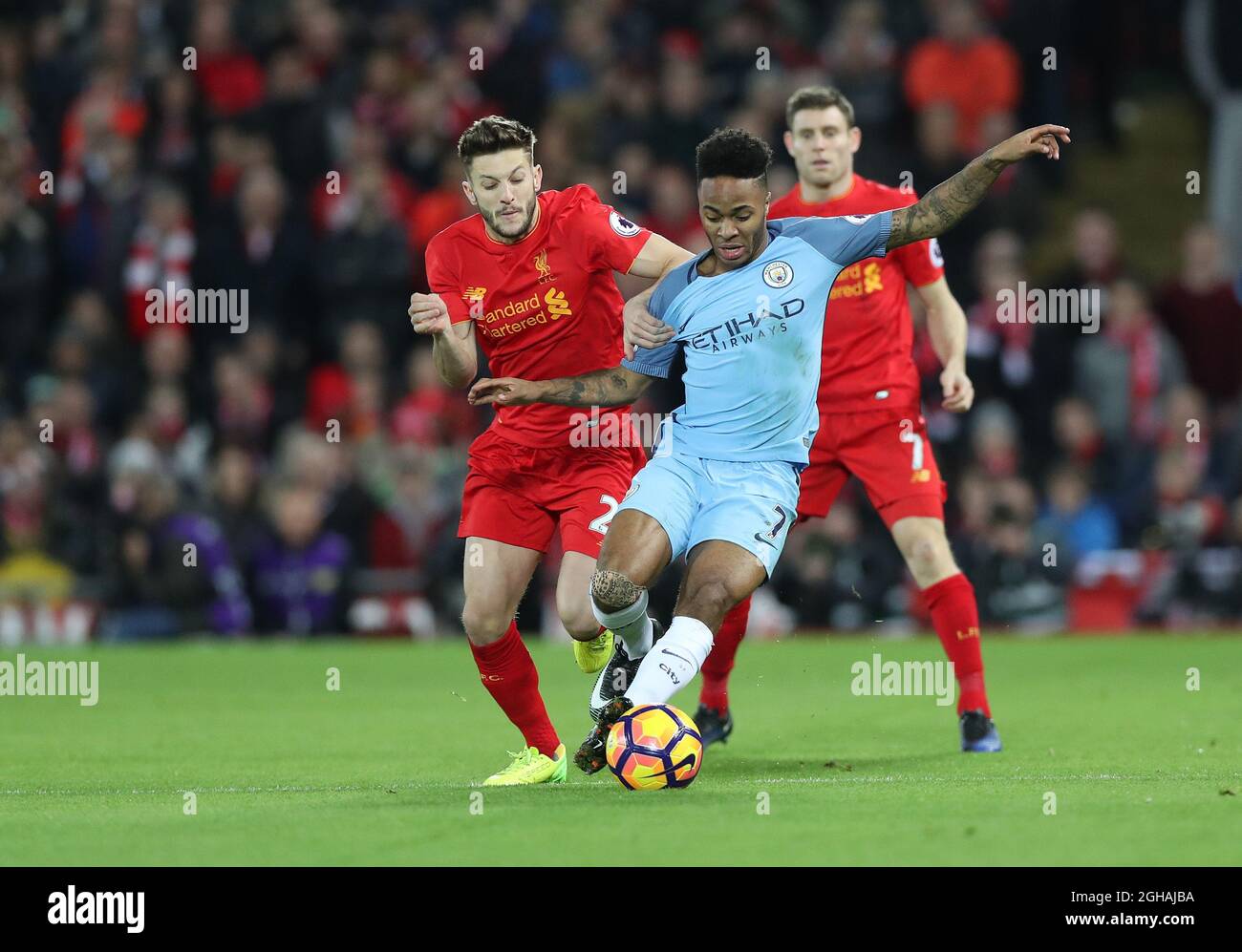 Adam Lallana of Liverpool and Raheem Sterling of Manchester City during ...