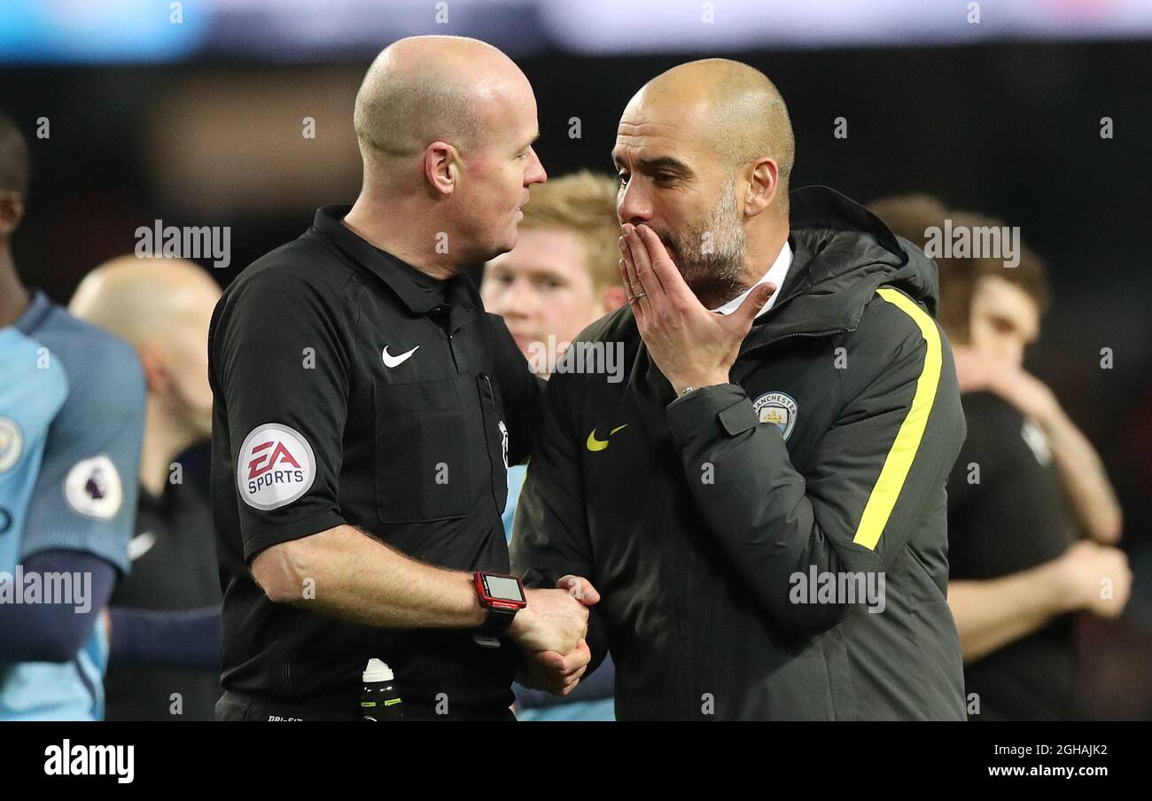 Manchester City Manager Pep Guardiola talks to referee Lee Mason after ...