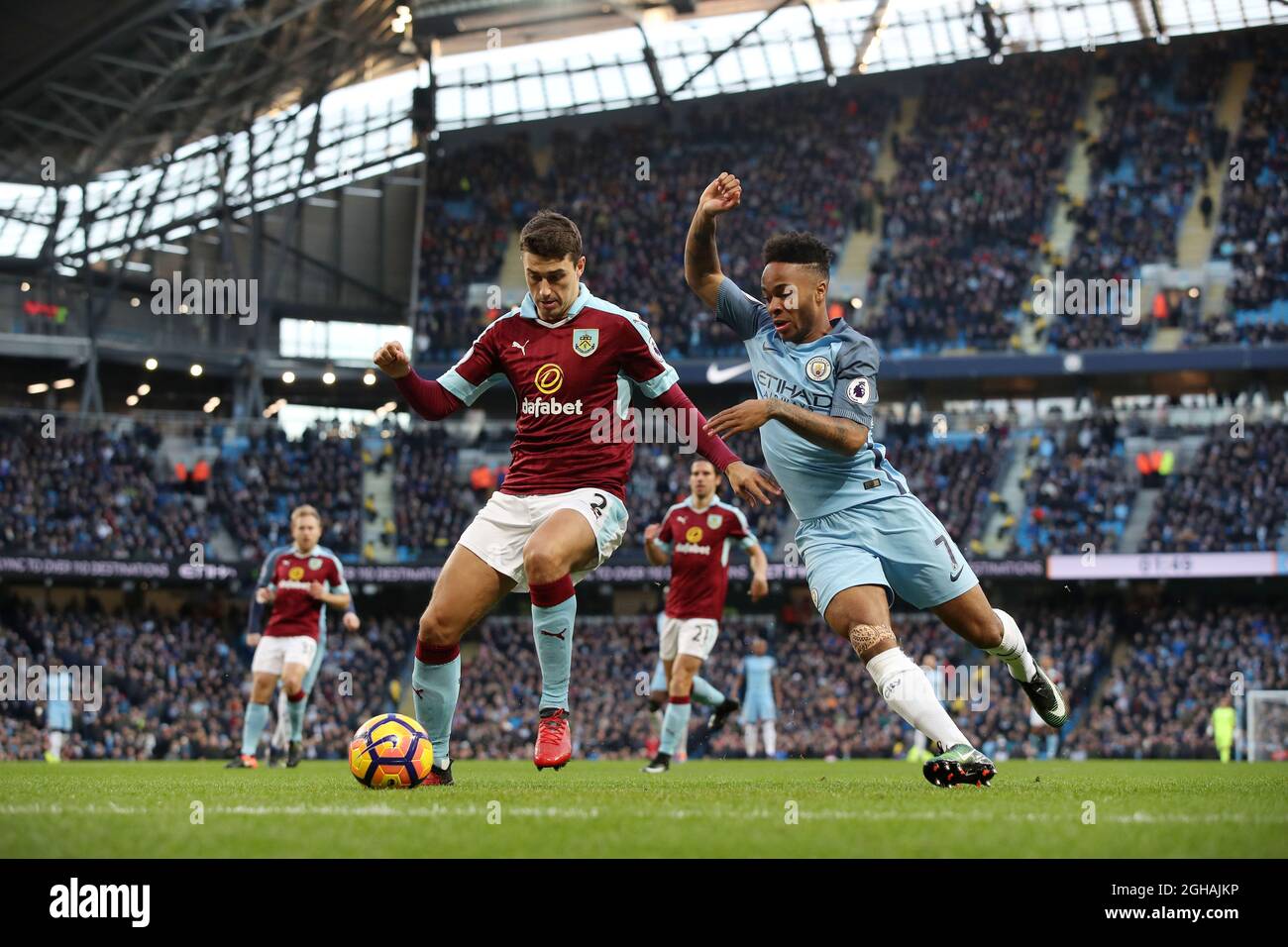 Matthew Lowton of Burnley and Raheem Sterling of Manchester City during ...