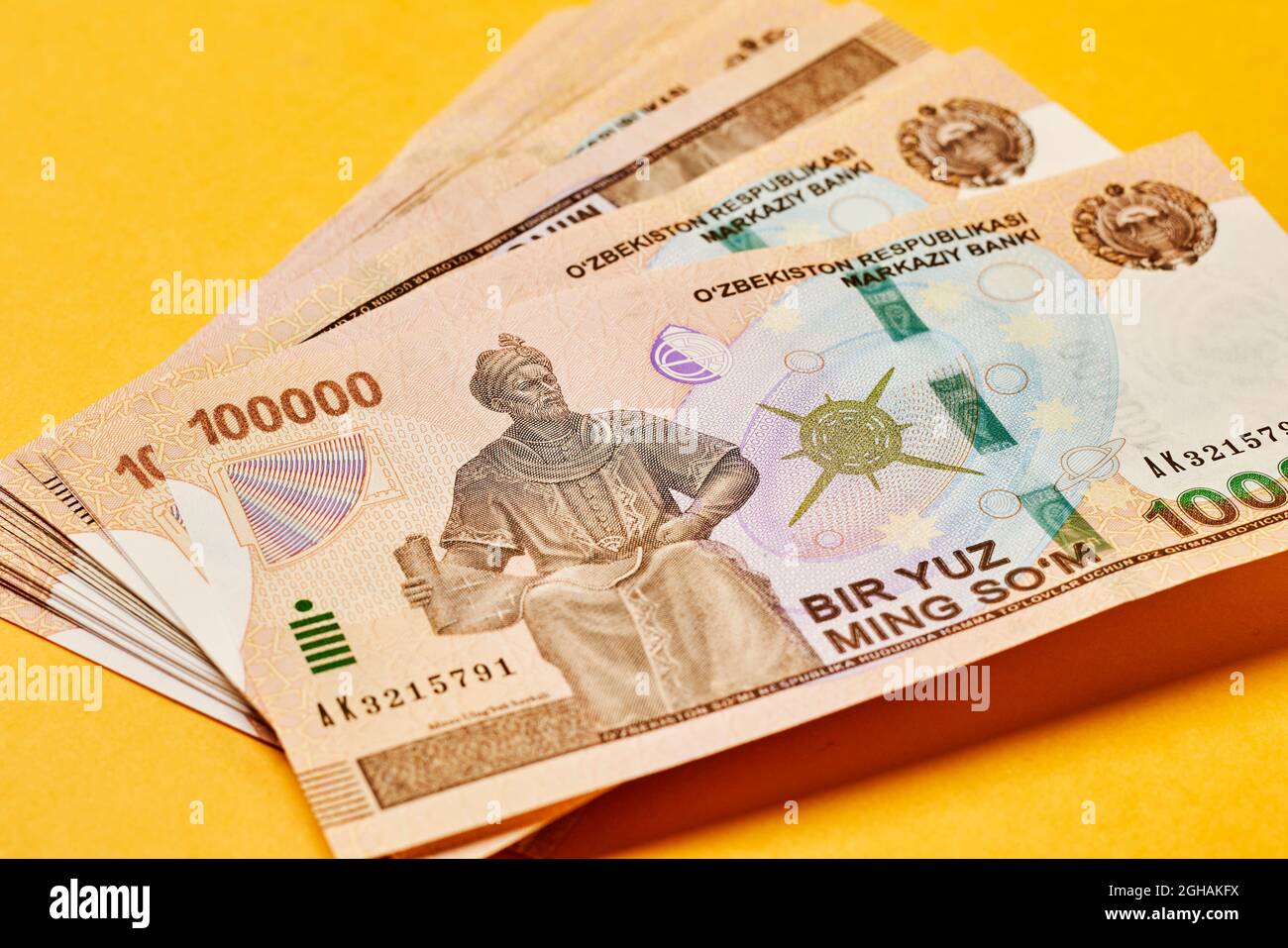 Pile Of Uzbek Sums On Yellow Uzbek Currency Money Bill A Stack Of One Pile Of Uzbek Sums On Yellow Uzbek Currency Money Bill A Stack Of One