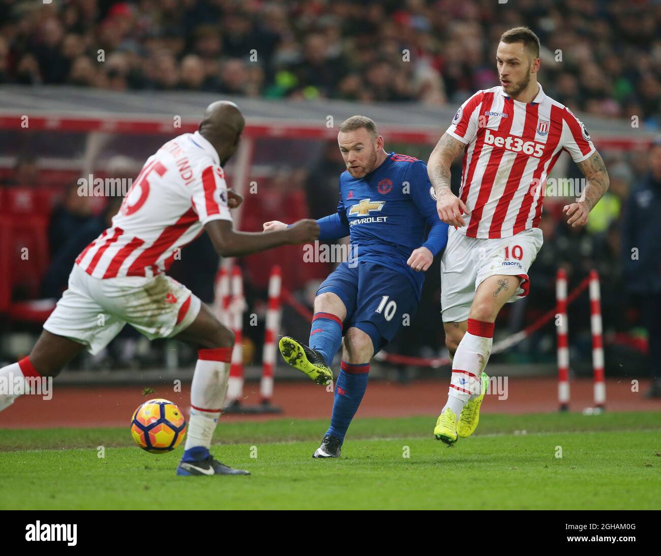 Stoke's Marco Arnautovic tussles with Manchester United's Wayne Rooney ...