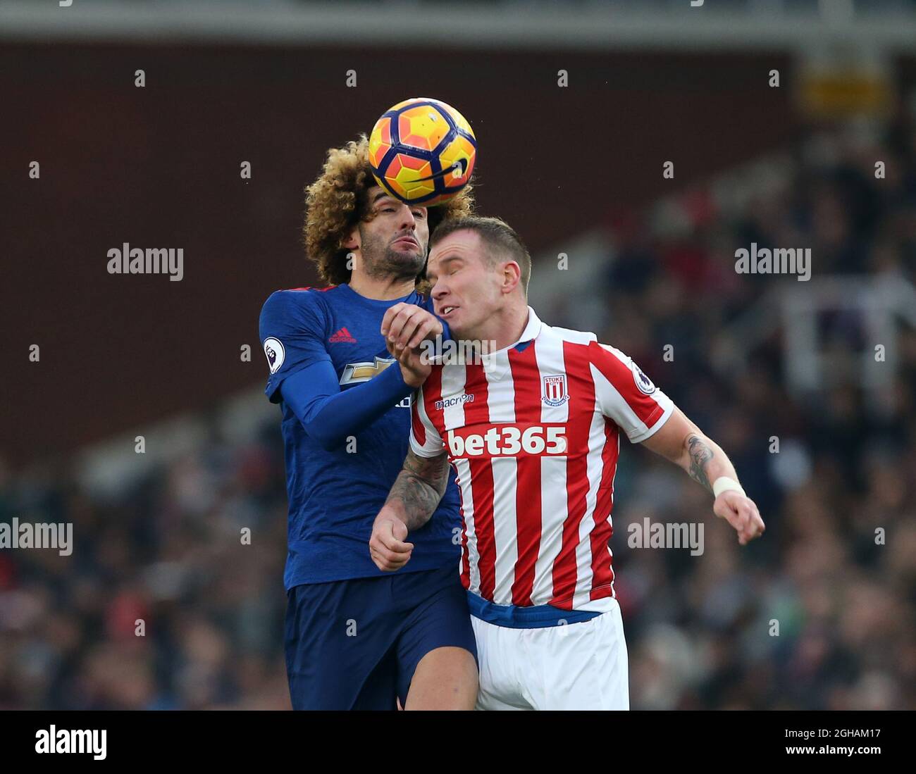 Manchester United's Marouane Fellaini tussles with StokeÕs Glenn Whelan ...