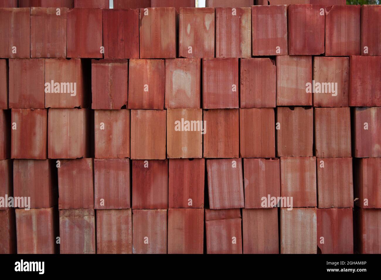 Orange Turkish style bricks waiting for a construction Stock Photo - Alamy