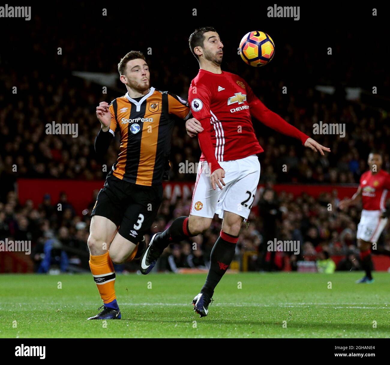 Andrew Robertson of Hull City in action with Henrikh Mkhitaryan of ...