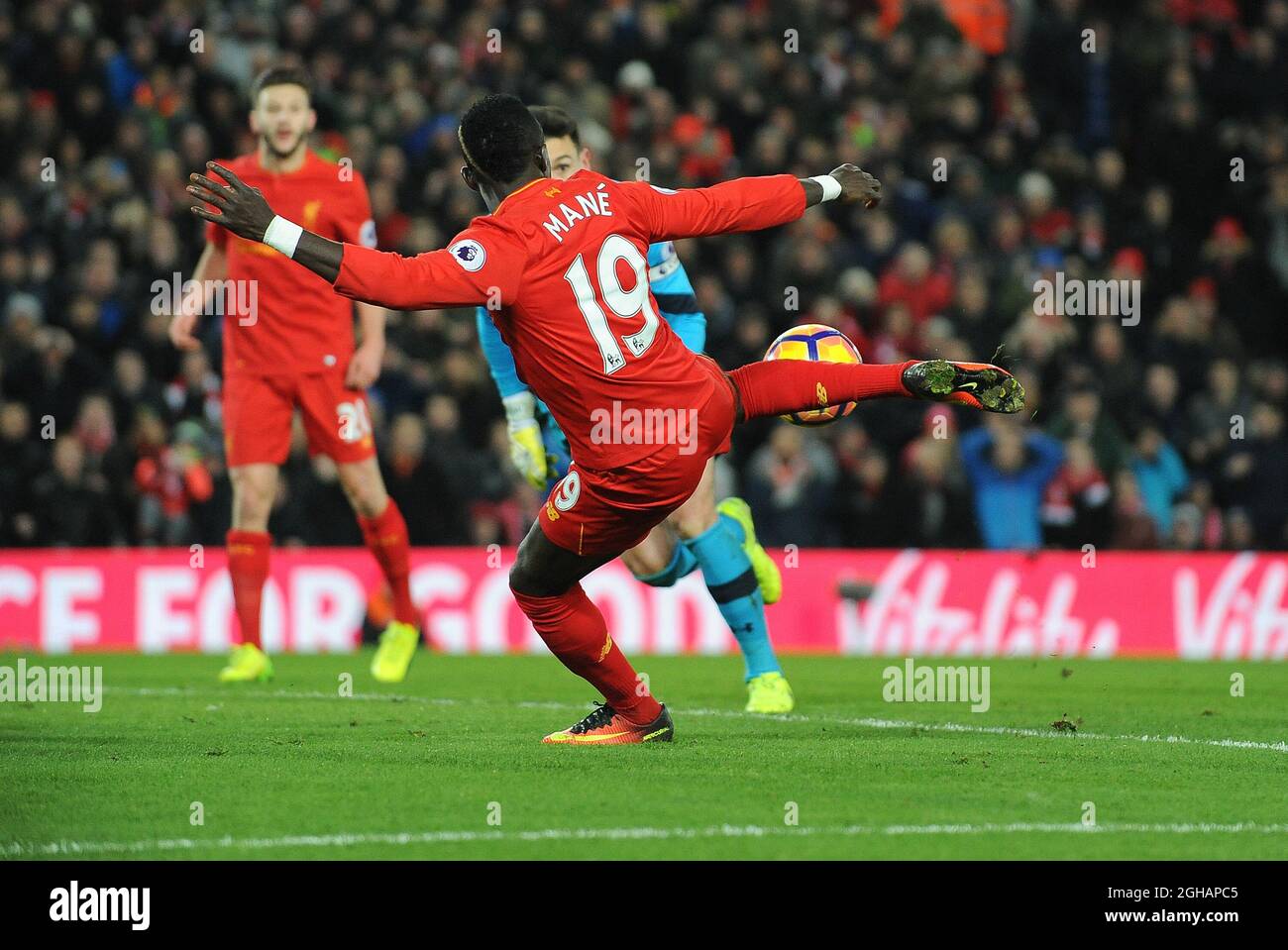 Sadio Mane of Liverpool scores his goal to make it 2-0 past Tottenham ...