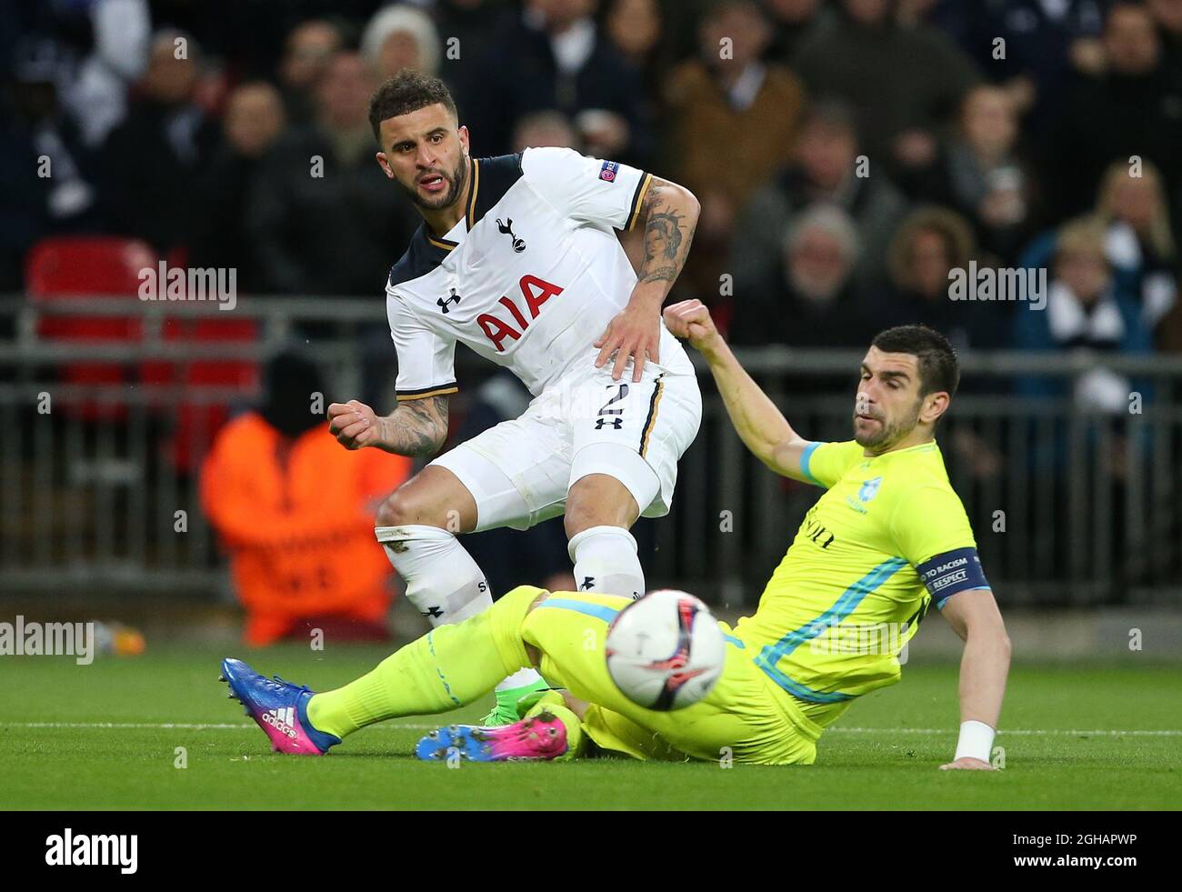 Tottenham's Kyle Walker tussles with Gent's Danijel Milicevic during ...