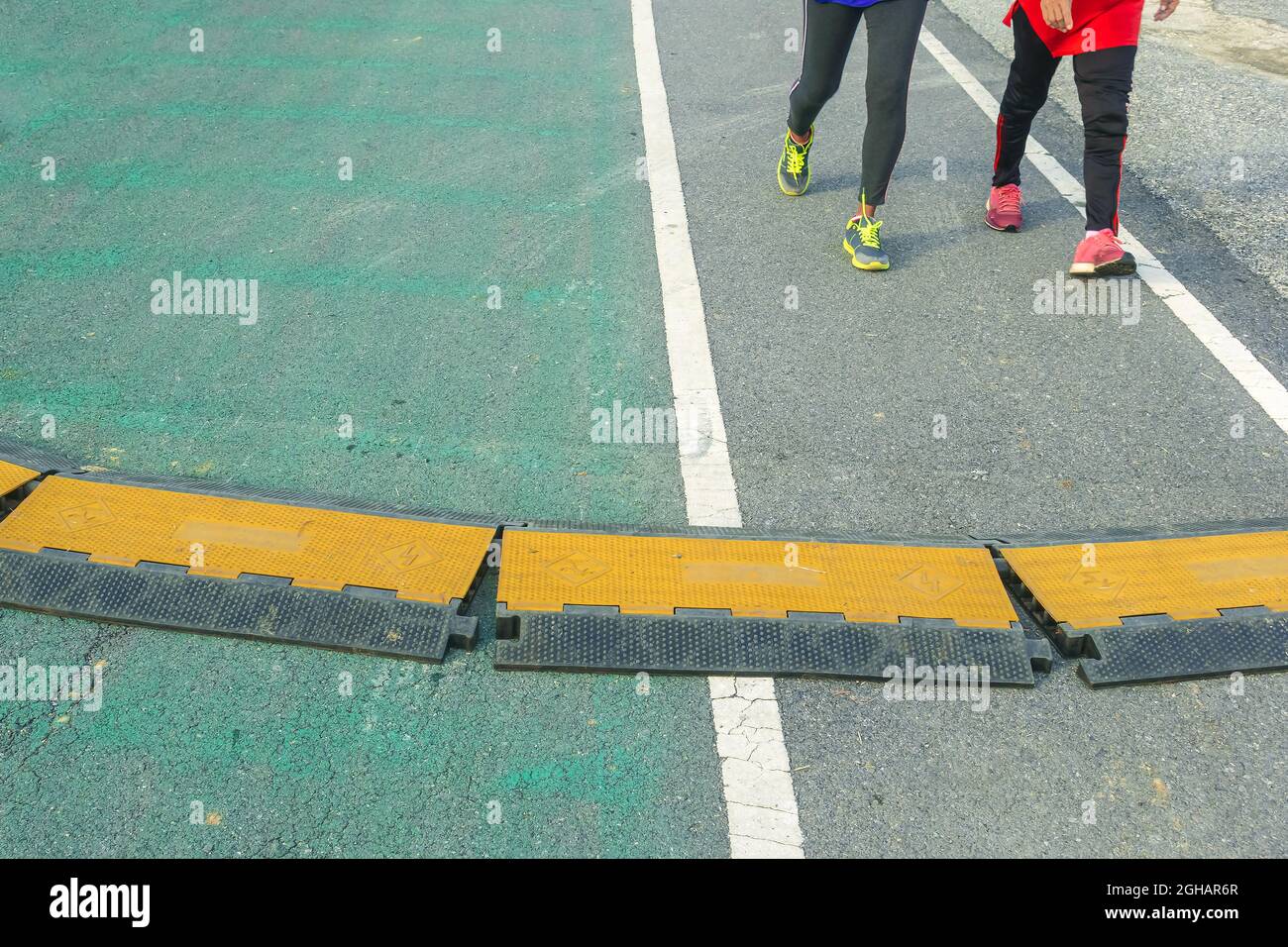 Black and yellow heavy plastic covers for people and vehicle to cross ...