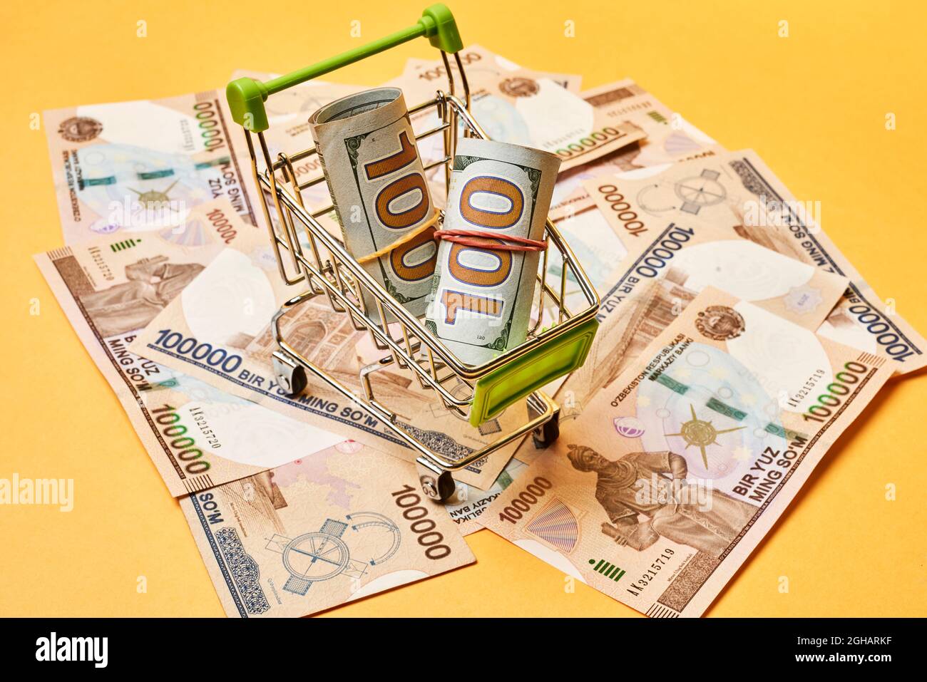 Buying us dollars in Uzbekistan. US dollars roll in shopping trolley ...