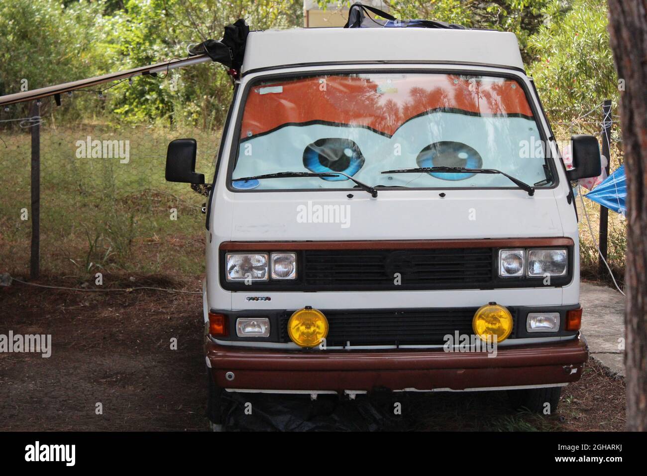 Cute camping van with eyes. Funny looking caravan. Campers happy home ...